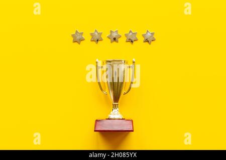 Five stars rating and winner trophy cup. Award and success concept ...