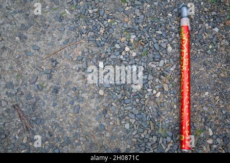 Background of gravel round stones . The exploded firecracker was thrown ...