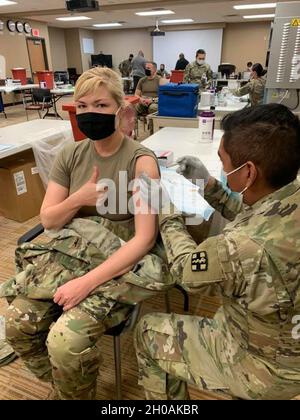 Commander of the 48th Chemical Brigade, Col W.M. Bochat, receives a ...