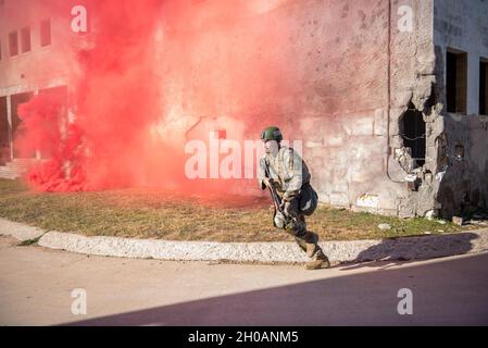 Sgt. Tyler Bisio from 61st Multifunctional Medical Battalion, dons his ...