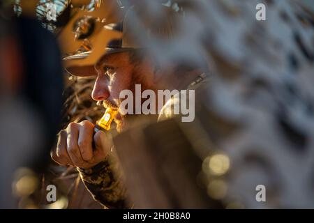 Eric Strand, a hunter with Born and Raised Outdoors, walks through ...