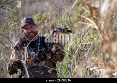Eric Strand, a hunter with Born and Raised Outdoors, walks through ...