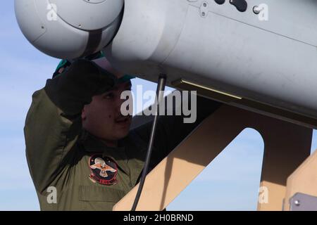 Lance Cpl. Irvin Serna, an aircraft avionics technician, checks wind ...