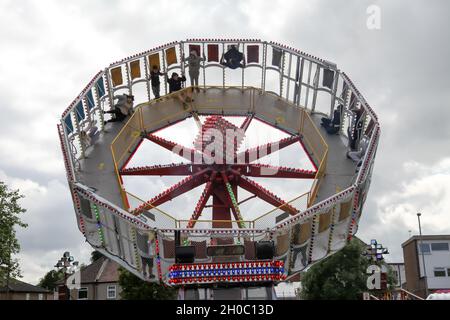 Crazy Cage gravity ride at Leatherhead Fun Fair, July 2021 Stock Photo ...