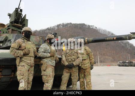 Sgt. Spencer Vanderbilt (left), the loader, Sgt. Bryan Dicandia (center ...
