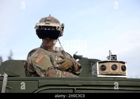 A Soldier dons the Integrated Visual Augmentation System (IVAS ...