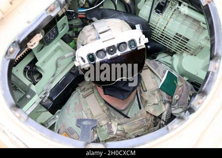 A Soldier dons the Integrated Visual Augmentation System (IVAS ...