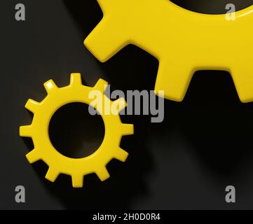 Two gears on black background Stock Photo - Alamy