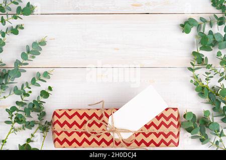 empty xmas wish list with little gift on wooden background Stock Photo ...