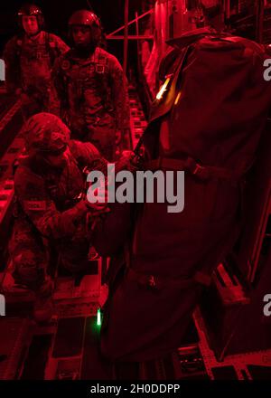 An 82nd Airborne Division Jumpmaster inspects a Paratrooper onboard a C ...
