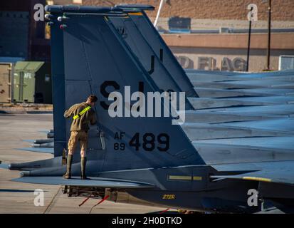 A 336th Tactical Fighter Squadron F-15E Eagle aircraft is readied for ...