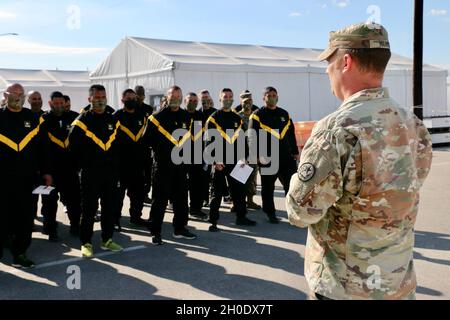 Sgt. 1st Class Robert Harris (foreground, right) injects Army Pfc ...