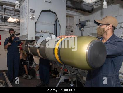 Sonar Technician (Submarines) 3rd Class Dylan Carpenter throws lines ...
