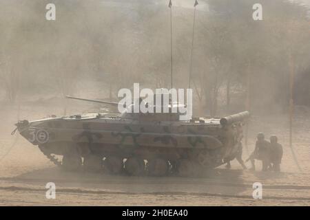 An Indian army's BMP-Infantry combat vehicle crosses a canal during a ...