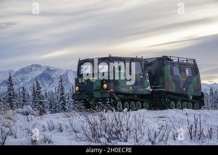 A Small Unit Support Vehicle (SUSV) is sling loaded to a CH-47 Chinook ...