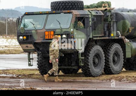 A convoy of support vehicles, assigned to 12th Combat Aviation Brigade ...