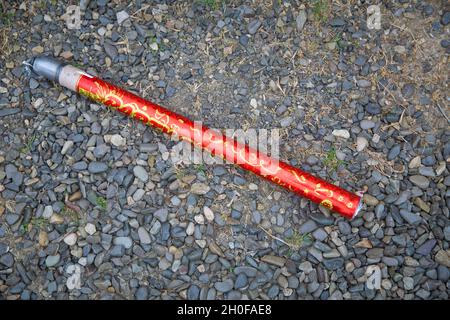Background of gravel round stones . The exploded firecracker was thrown ...
