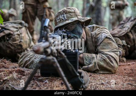 A Jungle Operations Training Course candidate applies face paint on Feb ...