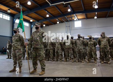 U.S. Army 2nd Lt. Sid Vega speaks to family members during a departure ...