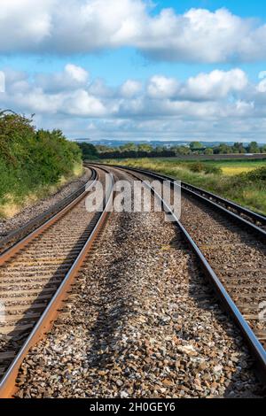 Vanishing railway lines on country line Stock Photo - Alamy