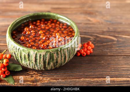 Bowl of tasty rowan jam on white background Stock Photo - Alamy