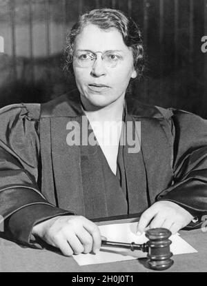 Female judge with gavel at workplace in courtroom Stock Photo - Alamy