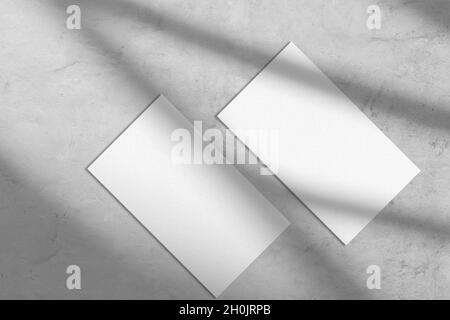 Two empty business card mockups on dark blue background Stock Photo - Alamy