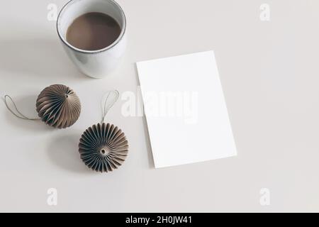 Winter festive stationery still life. Brown paper Christmas ornaments ...
