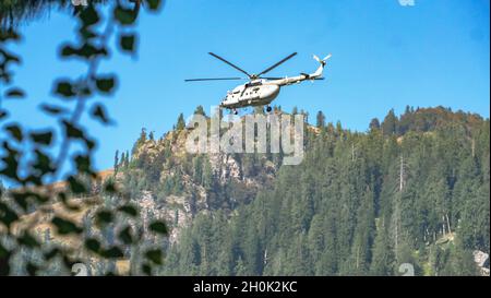 Helicopter flying Over the Mountains of Manali Valley Stock Photo - Alamy