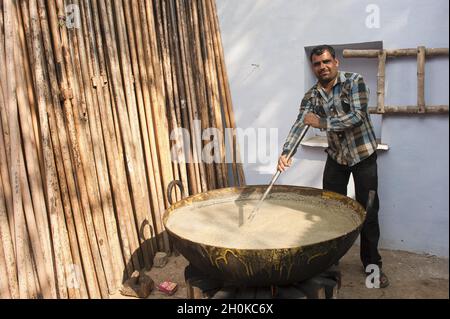 An Indian man cooking millet in Neemrana, India Stock Photo - Alamy
