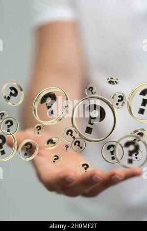 A 3d rendering of floating question marks with a hand pointing at them ...