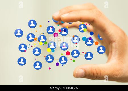 Hand holding 2d icons Stock Photo - Alamy