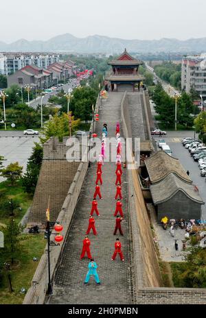Xuanhua, China. 14th Oct, 2021. Tai Chi enthusiasts in Xuanhua District ...