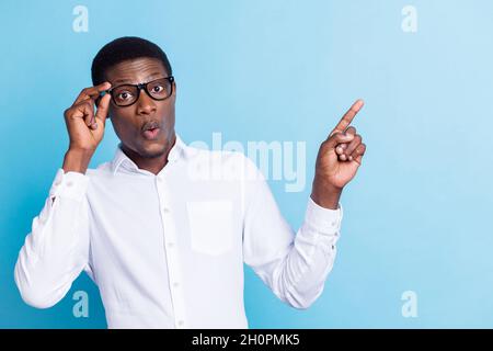 Photo of charming excited guy dressed orange sweater eyewear tacking ...