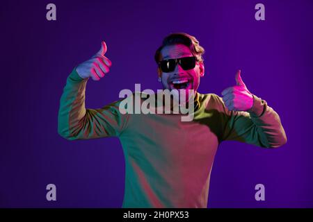 Photo of youngster guy impressed advert promo point empty space hand ...