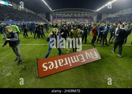 Wigan fans invade the pitch at the final whistle Stock Photo - Alamy