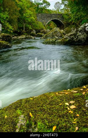 The River Llugwy flowing under the stone bridge at Pony Cyfnyg in Capel ...