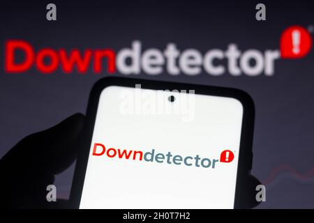 In this photo illustration, Downdetector logo seen displayed on a ...