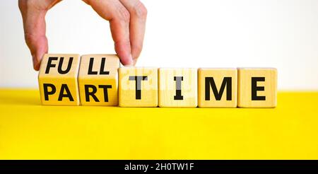Full or part time symbol. Businessman turns wooden cubes and changes ...