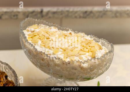 A bowl of soup puree on a buffet table with small bowls around Stock ...
