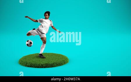 Soccer ball on a grassy plate with cyan background Stock Photo - Alamy