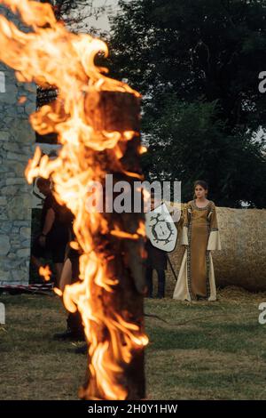 ARD, ROMANIA - Aug 21, 2021: A man standing near the Crusades flag ...