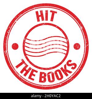 HIT THE BOOKS text written on red zig-zag stamp sign Stock Photo - Alamy