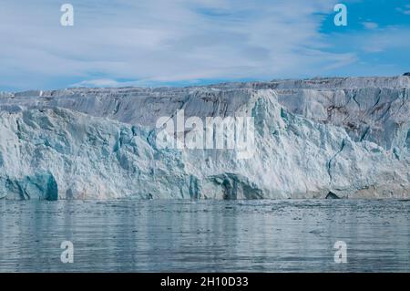 Arctic waters fronting massive walls of ice on Lilliehook Glacier ...