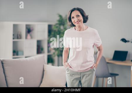 Photo of optimistic brunette lady look empty space wear pink shirt ...