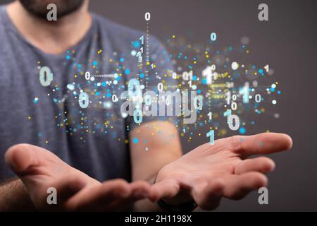 Illustration of binary codes in a human hand Stock Photo - Alamy