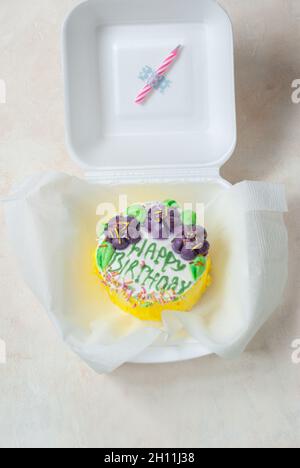 Sweet bento cake with gift box and beautiful flowers on pink background ...