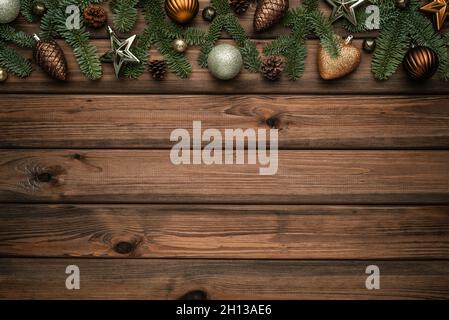 Christmas frame made of fir branches decorated with balls, candy canes ...