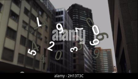 Image of falling numbers over cityscape Stock Photo - Alamy