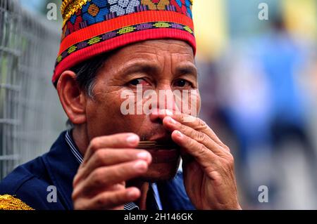 A Dusun ethnic man from Kiulu, Sabah, Malaysia, demonstrates playing ...